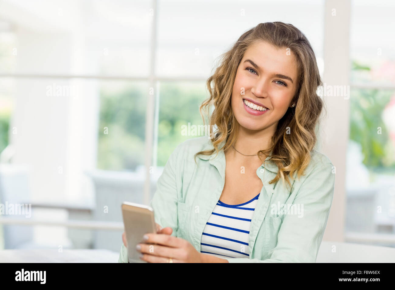 Woman using smartphone Stock Photo - Alamy