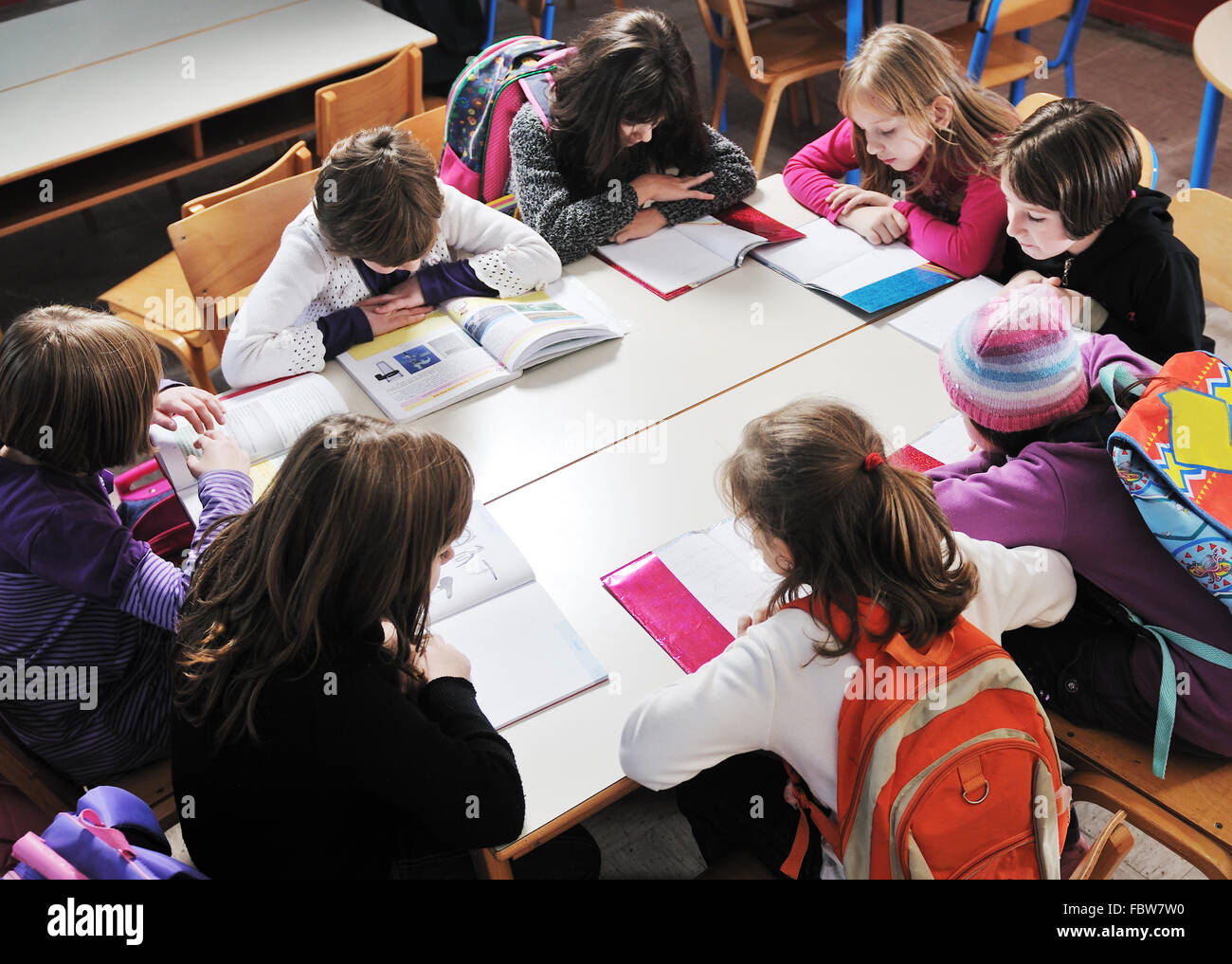 happy kids with teacher in school classroom Stock Photo - Alamy