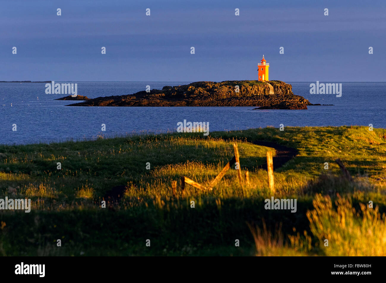 Lighthouse on small island at sunrise, Flatey Island, Iceland, Europe ...