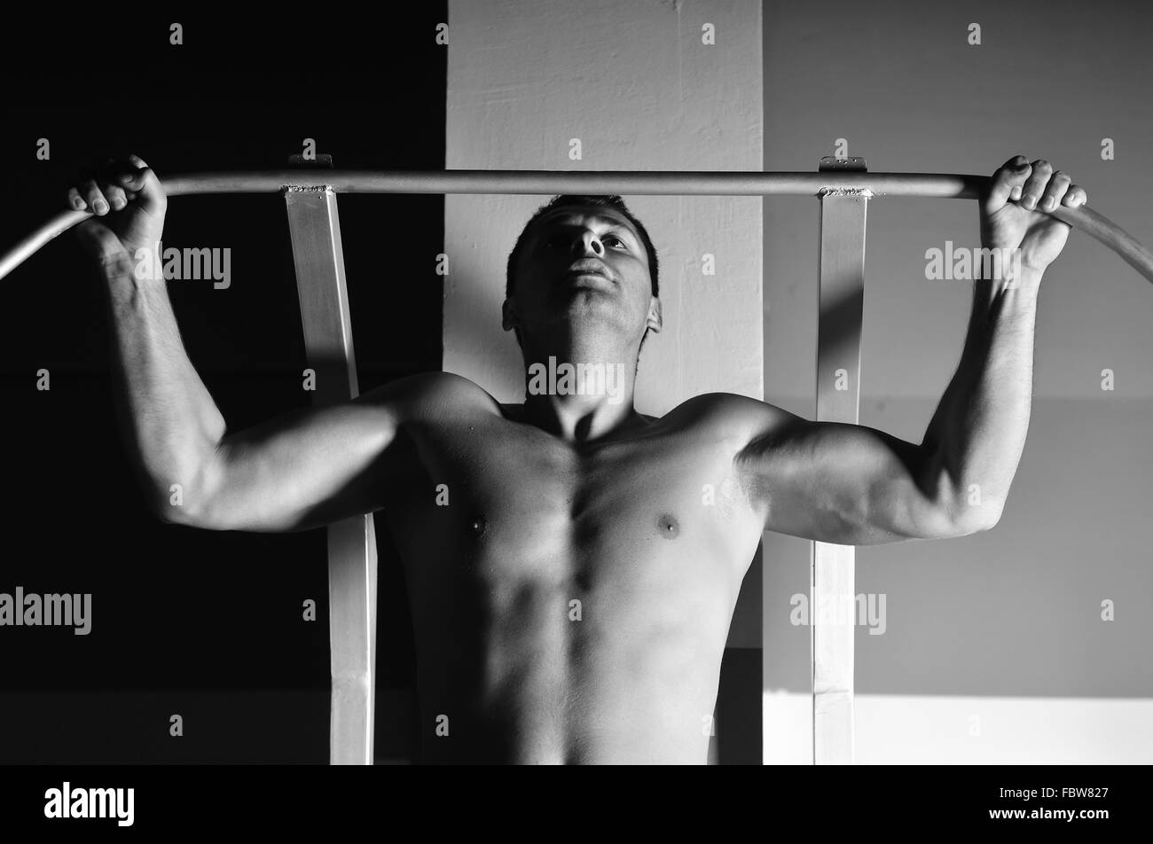 young man with strong arms working out in gym Stock Photo - Alamy