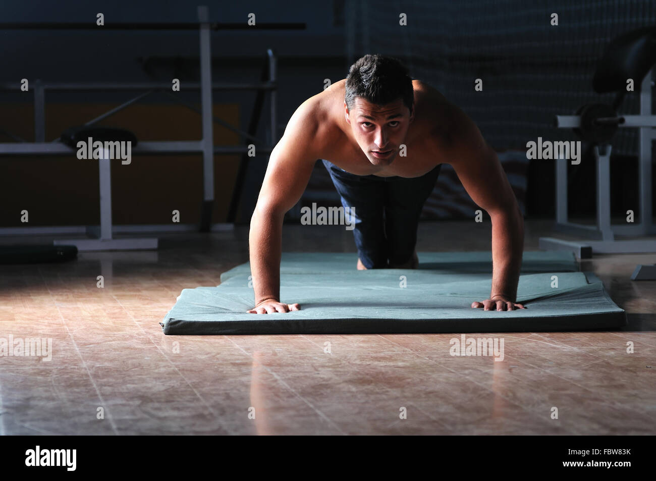 young man with strong arms working out in gym Stock Photo - Alamy