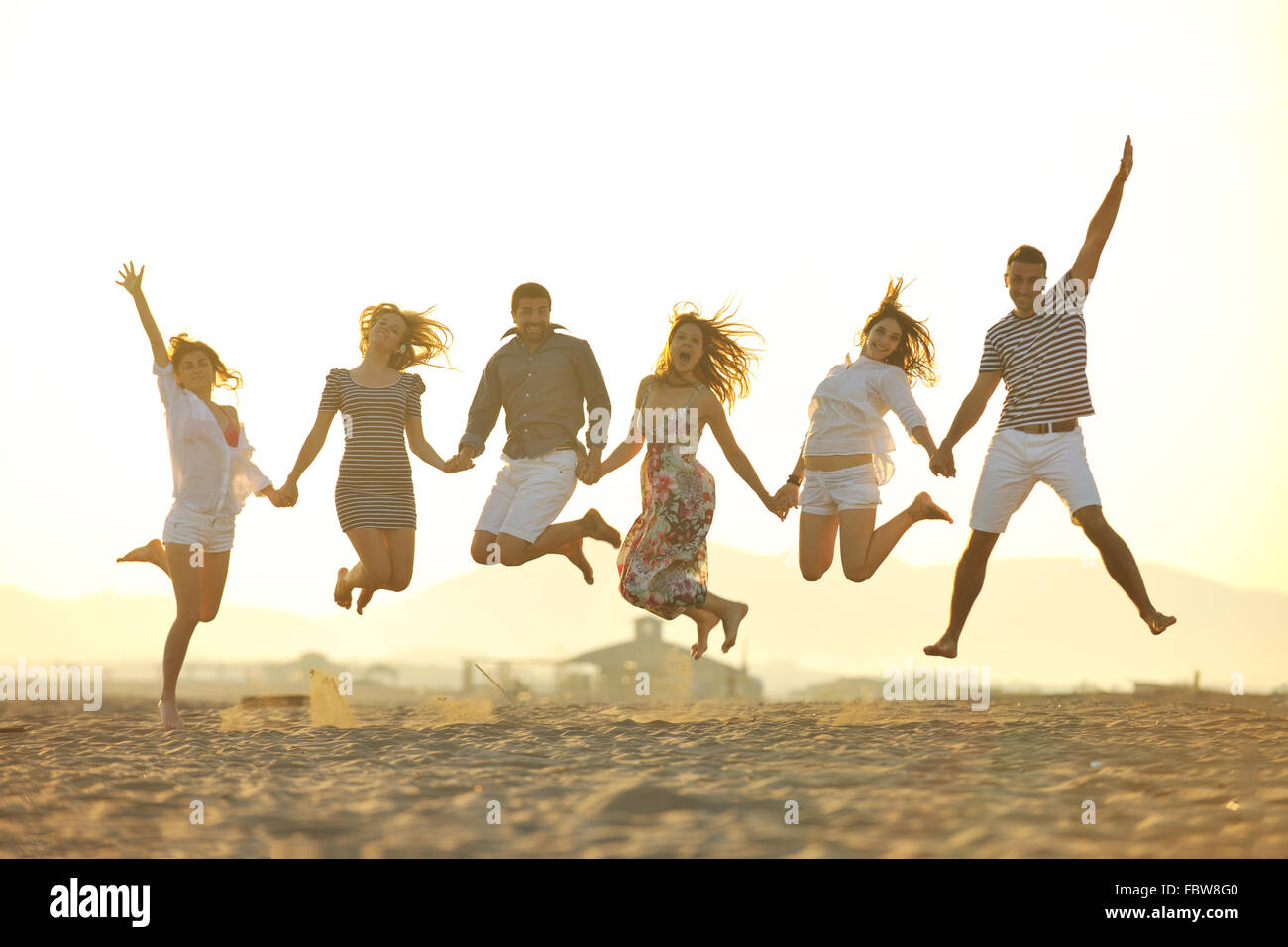 happy young people group have fun on beach Stock Photo - Alamy
