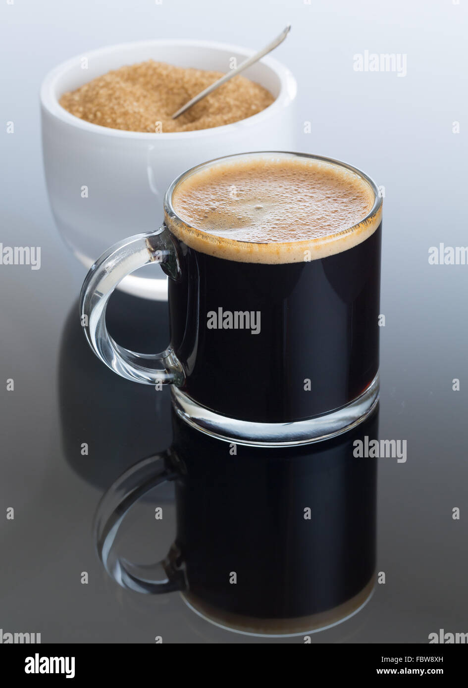 Black coffee and froth in glass mug with sugar Stock Photo - Alamy