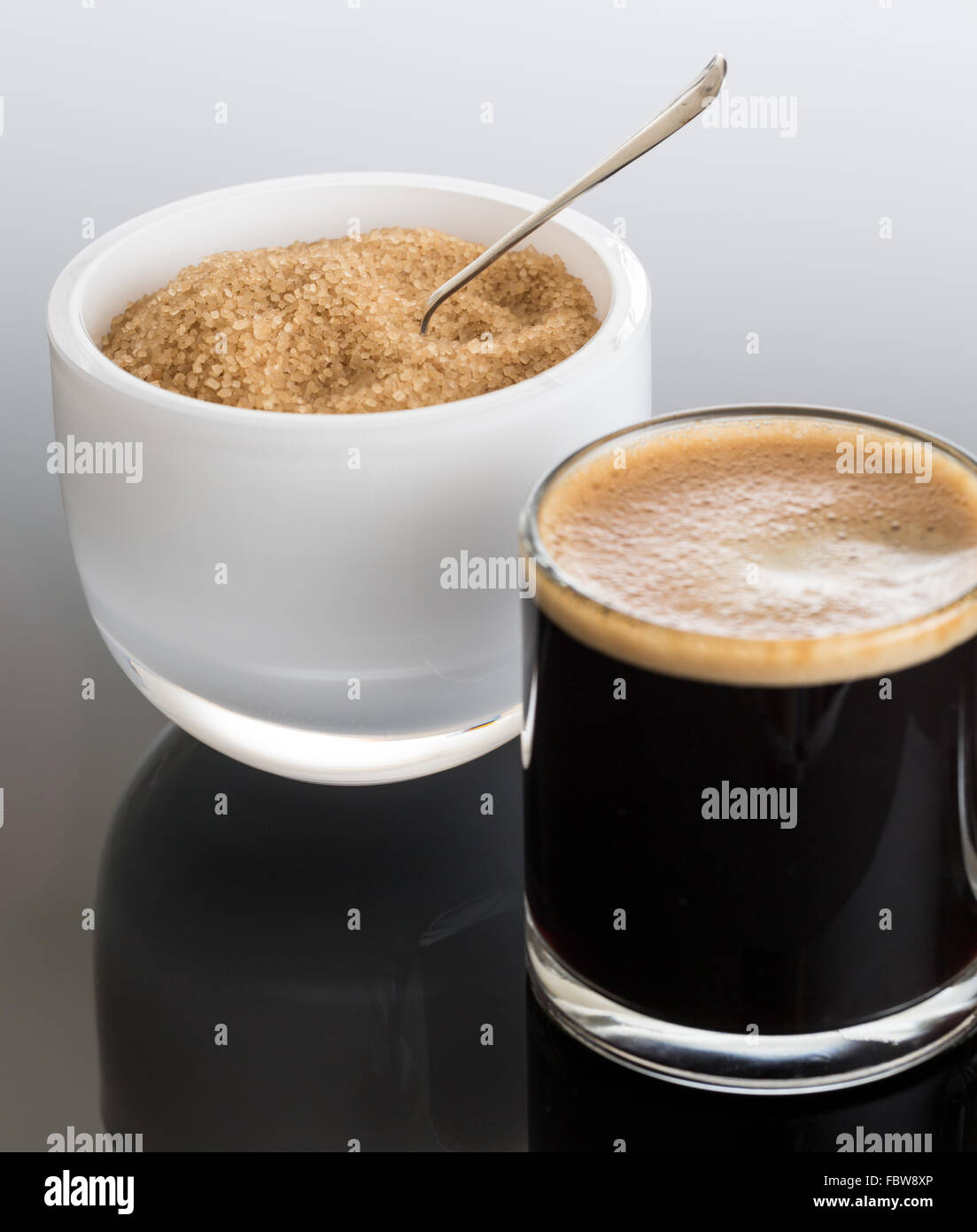 Black coffee and froth in glass mug with sugar Stock Photo - Alamy
