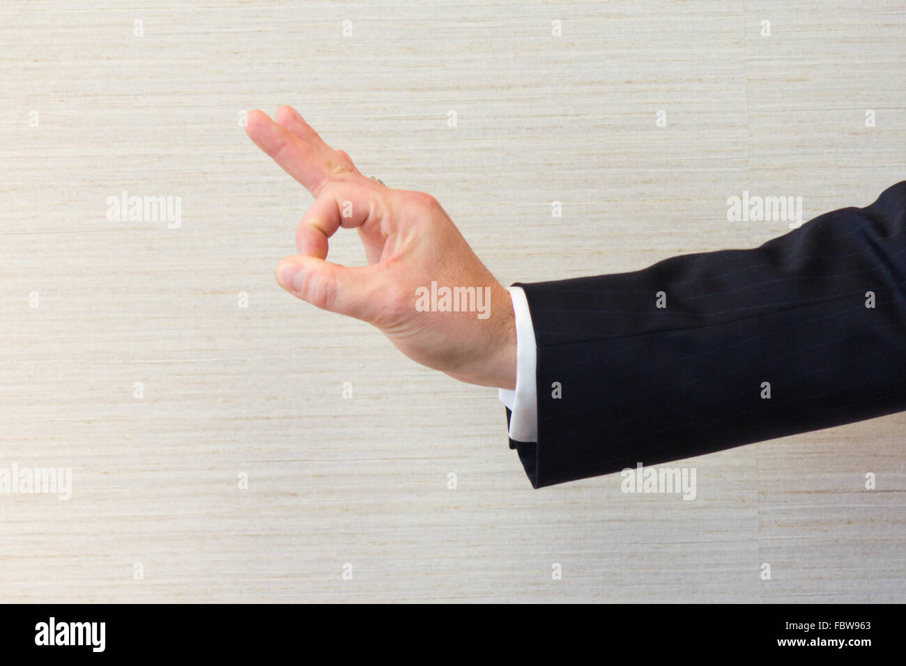 Business man gestures ok sign Stock Photo - Alamy