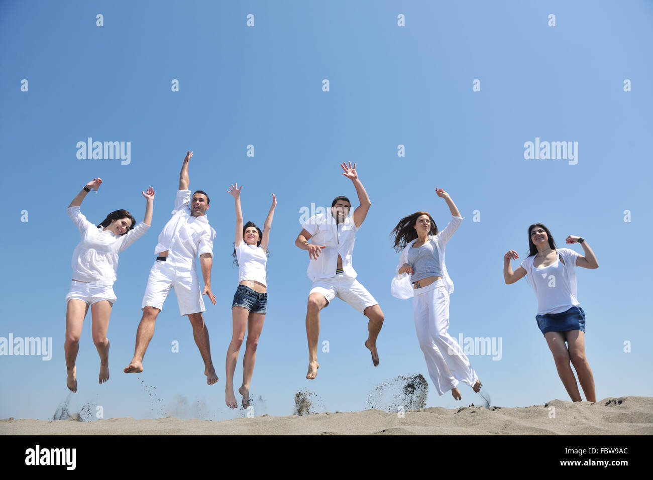 happy people group have fun and running on beach Stock Photo - Alamy