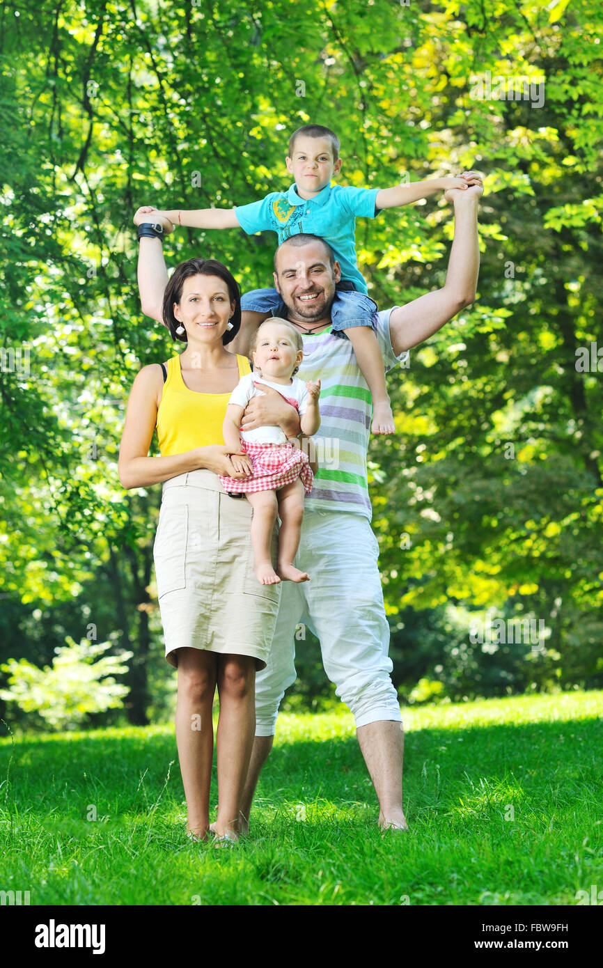 happy young couple with their children have fun at park Stock Photo - Alamy