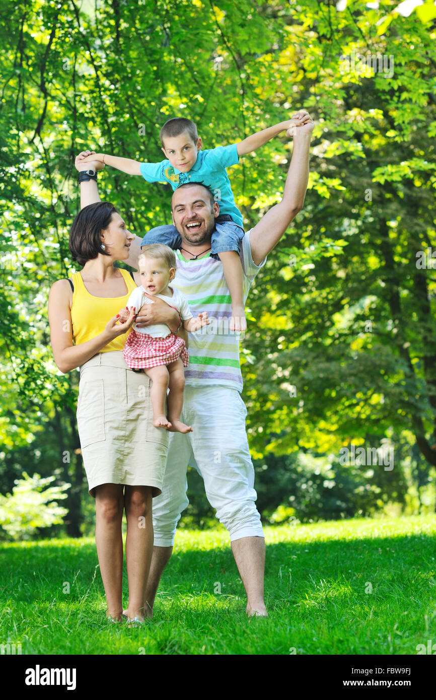 happy young couple with their children have fun at park Stock Photo - Alamy