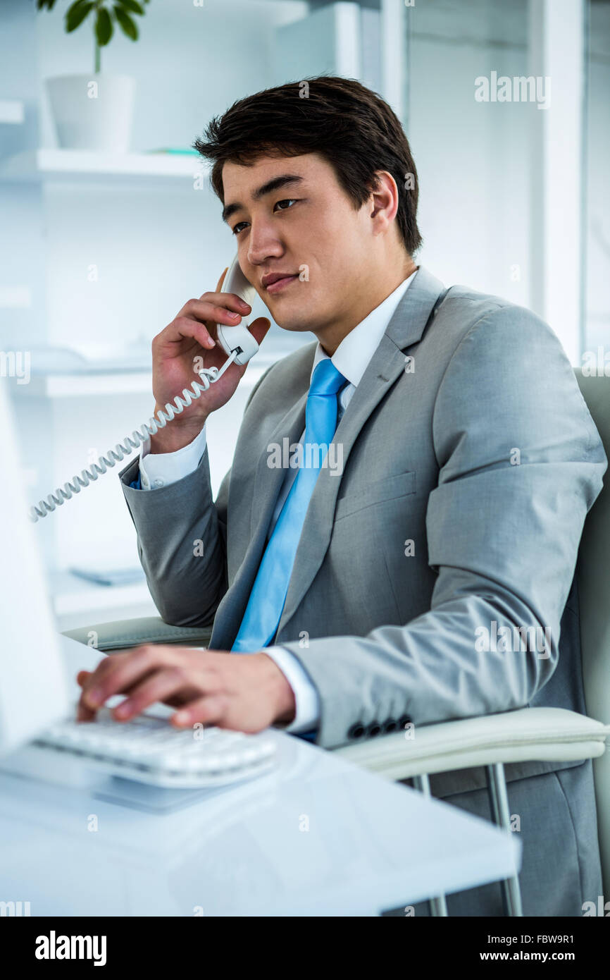 Businessman making a phone call Stock Photo - Alamy