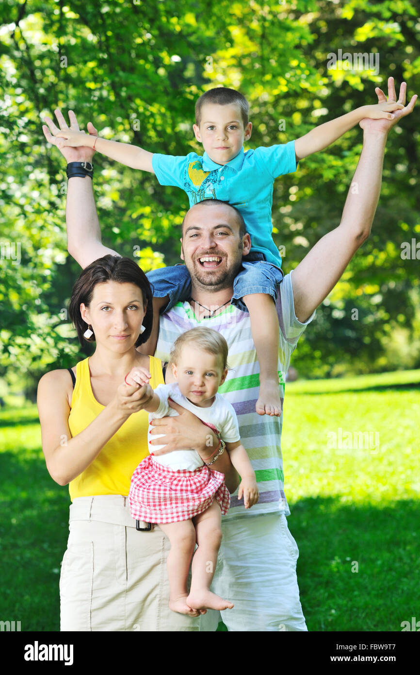 happy young couple with their children have fun at park Stock Photo - Alamy