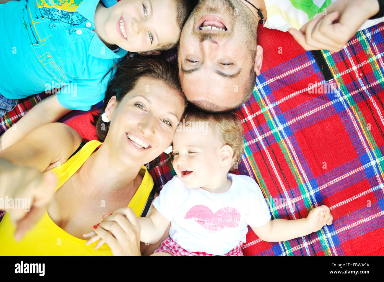 happy young couple with their children have fun at park Stock Photo - Alamy