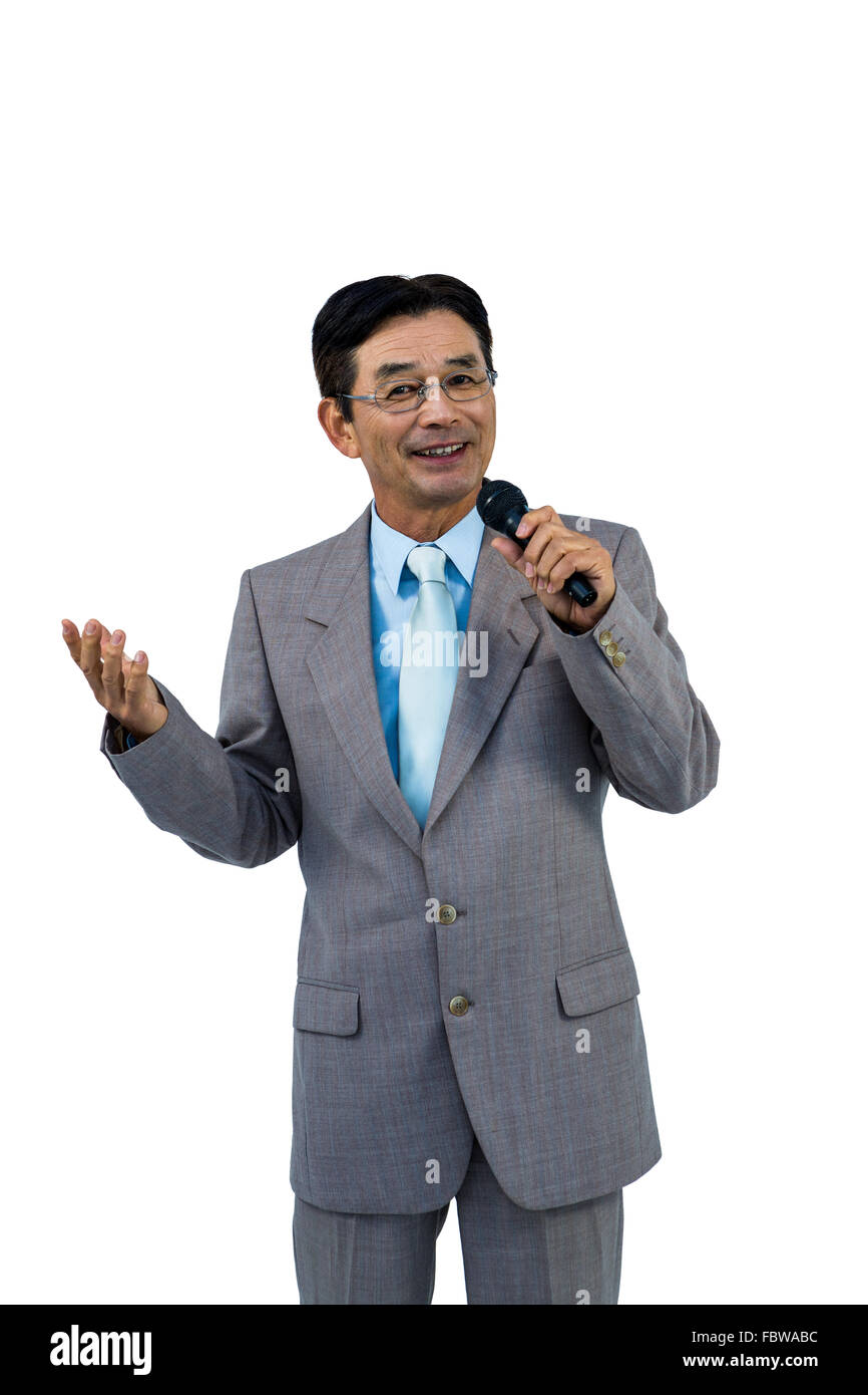 Asian businessman holding microphone Stock Photo - Alamy