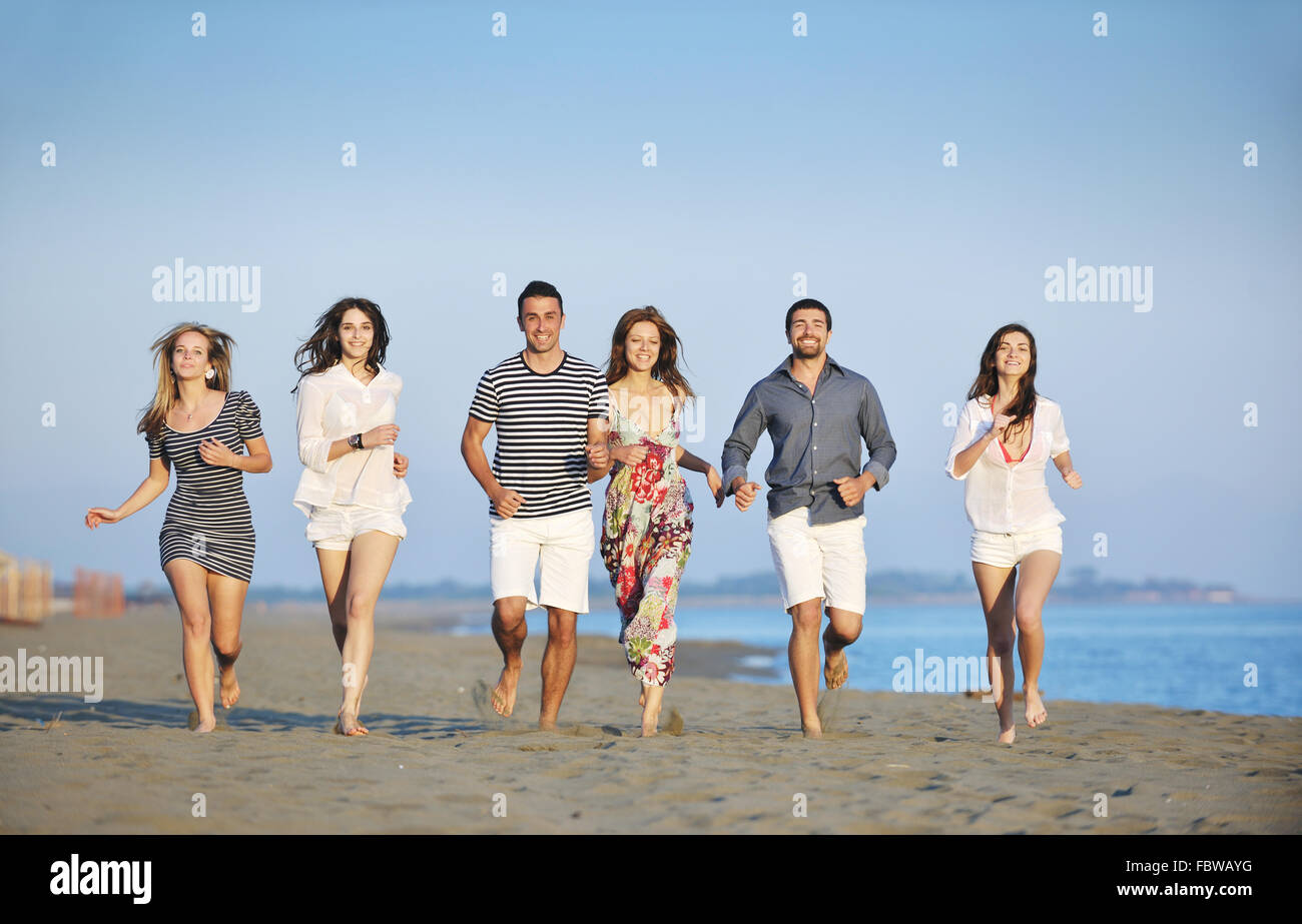 happy young people group have fun on beach Stock Photo - Alamy