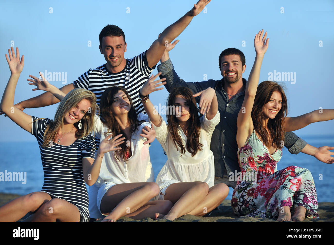 happy young people group have fun on beach Stock Photo - Alamy