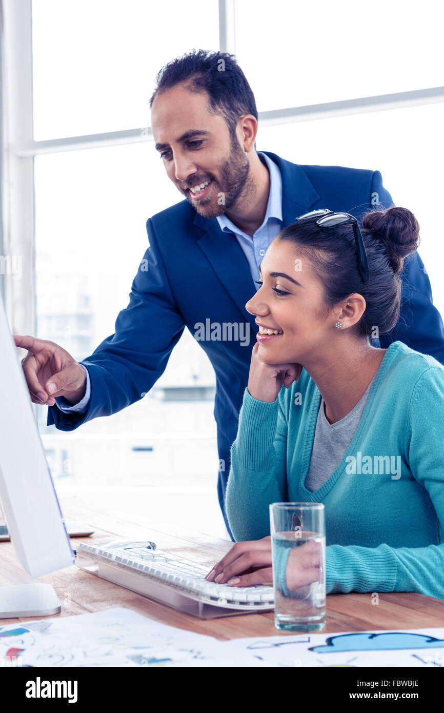 Happy businessman explaining to coworker Stock Photo - Alamy