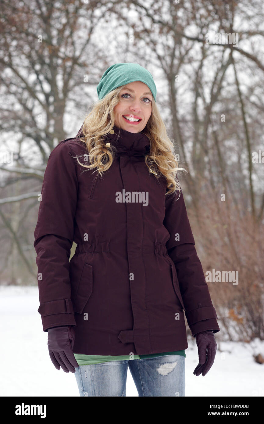 Happy winter woman wearing cap hi-res stock photography and images - Alamy