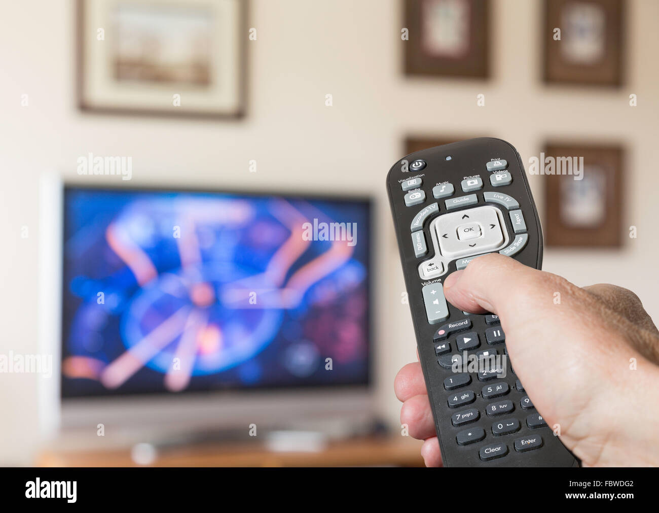 Close up of TV remote control with television Stock Photo - Alamy