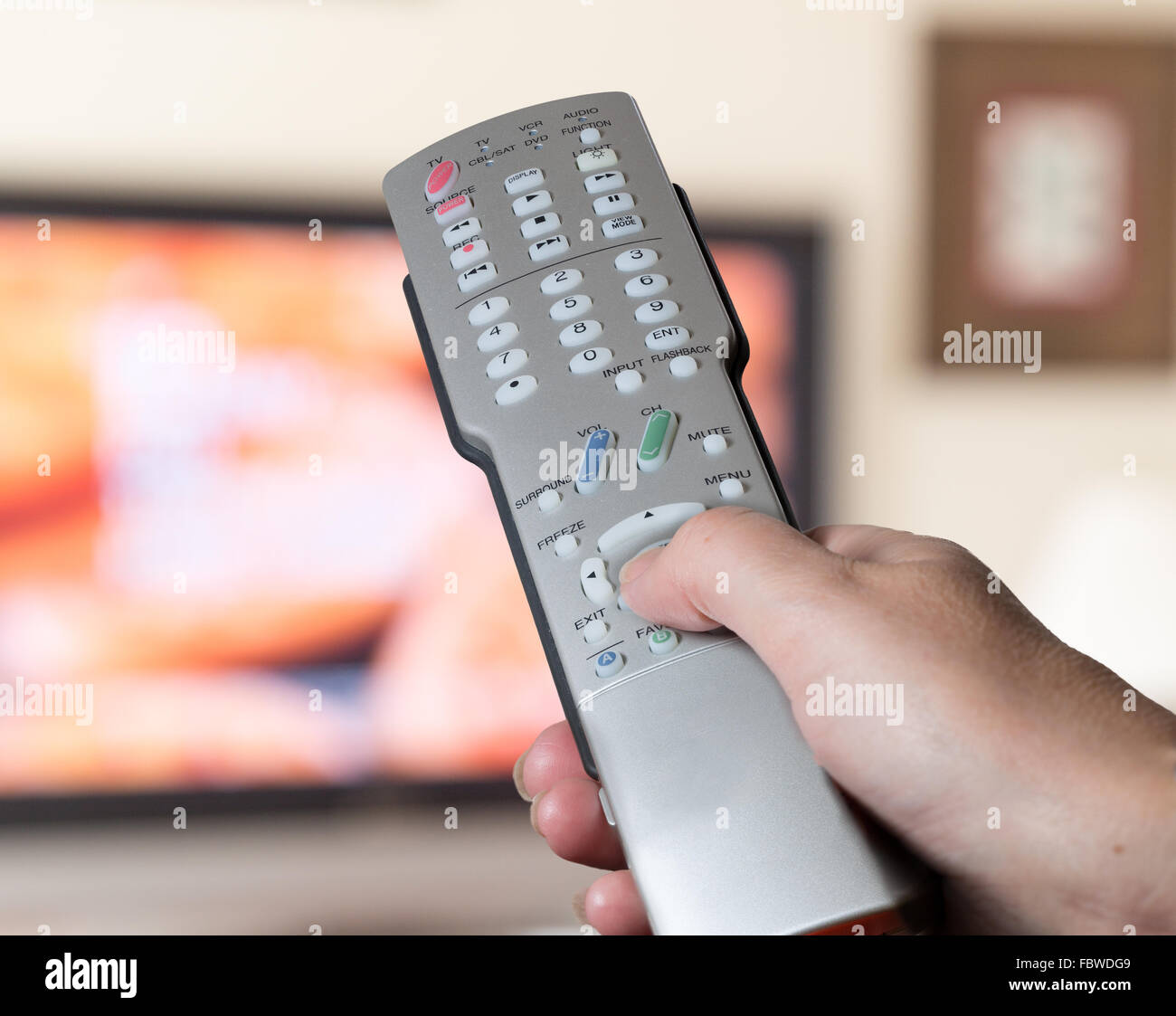 Close up of TV remote control with television Stock Photo - Alamy