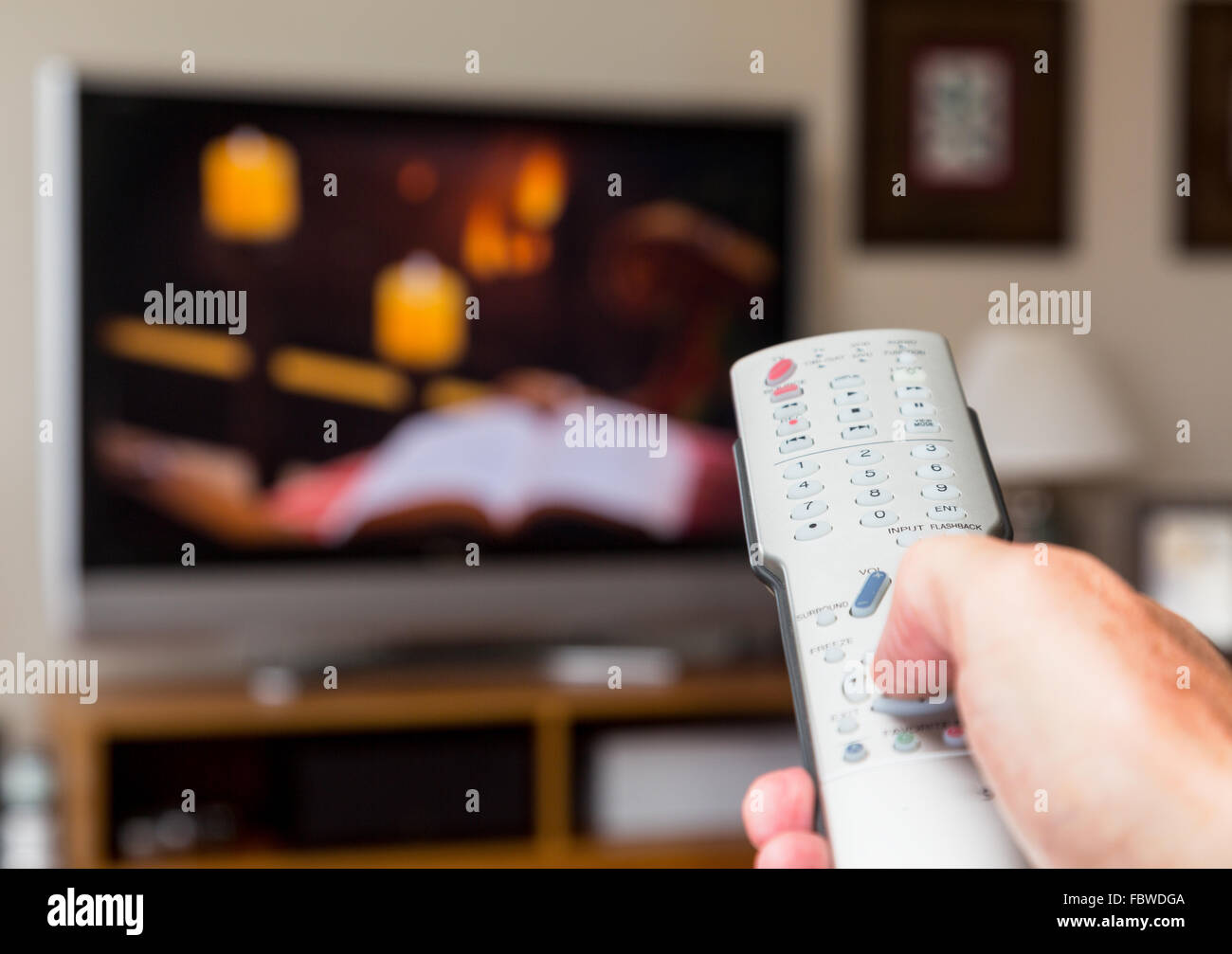 Close up of TV remote control with television Stock Photo - Alamy