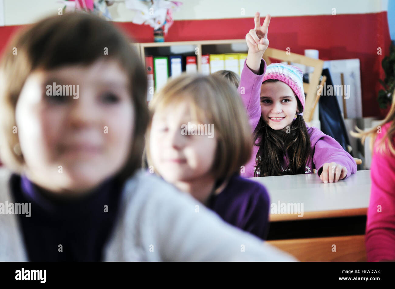 happy kids with teacher in school classroom Stock Photo - Alamy