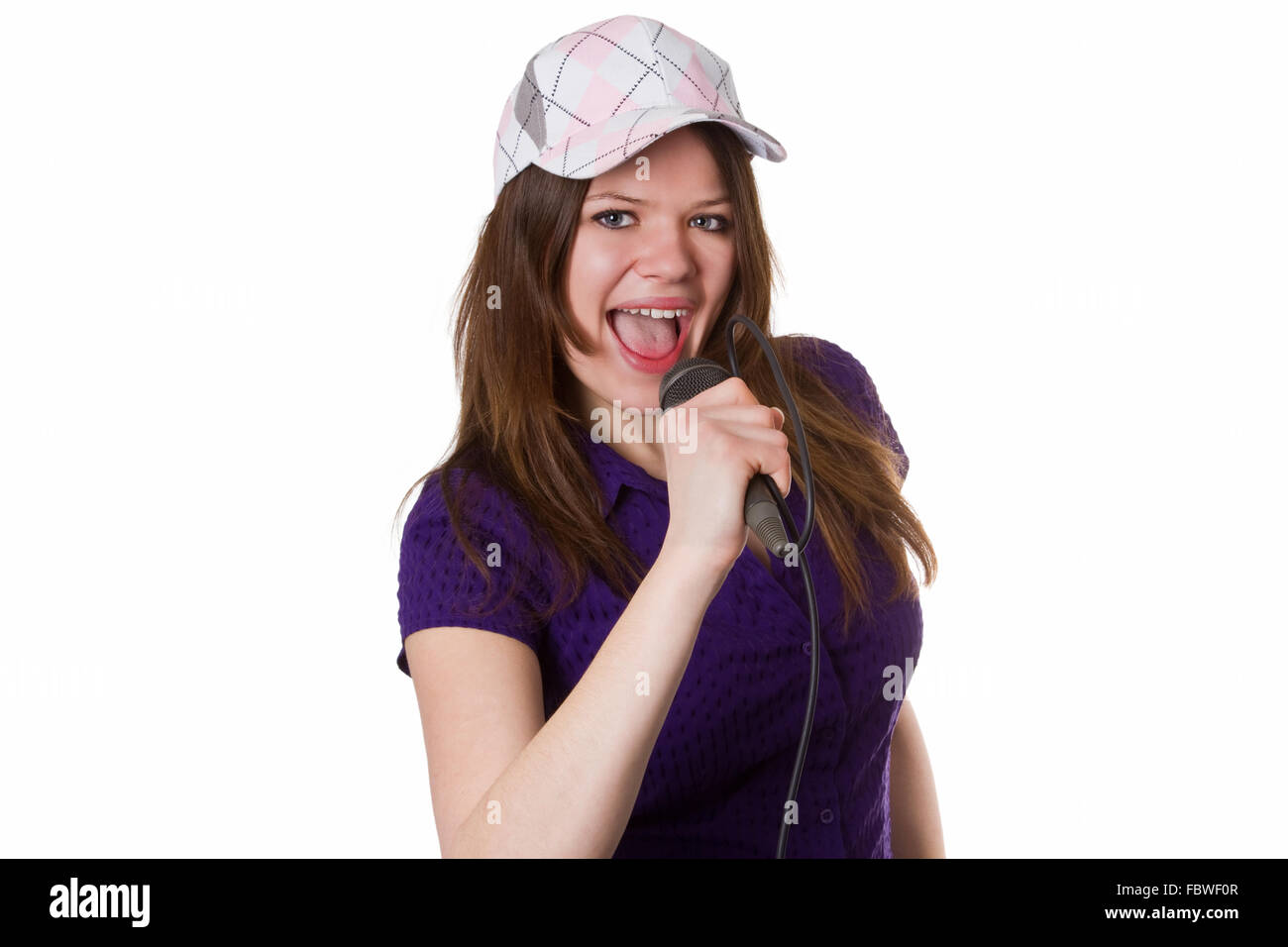 Woman with cap singing Stock Photo - Alamy