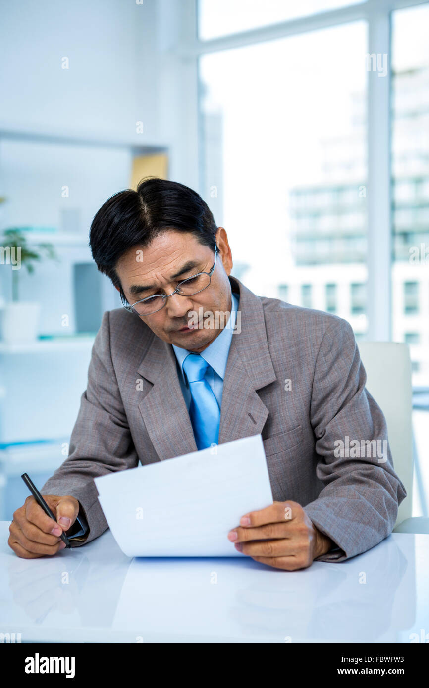 Focused businessman looking paper hi-res stock photography and images ...