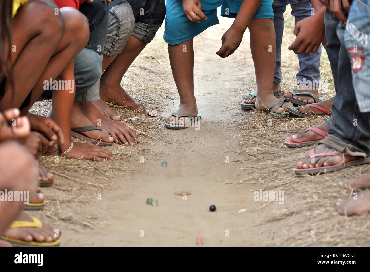 Children playing marbles hi-res stock photography and images - Alamy