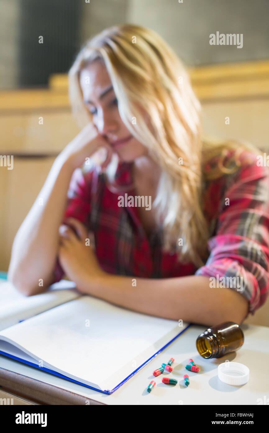 Thoughtful female student during class Stock Photo - Alamy