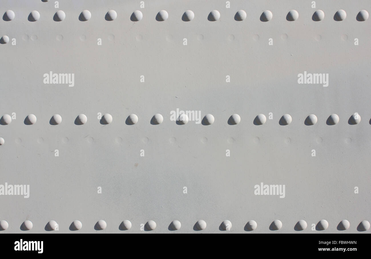 A silver painted metal aircraft background with rivets Stock Photo - Alamy