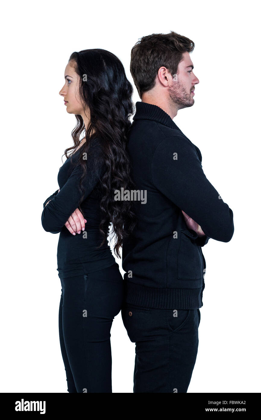 Couple standing back to back after argument Stock Photo - Alamy