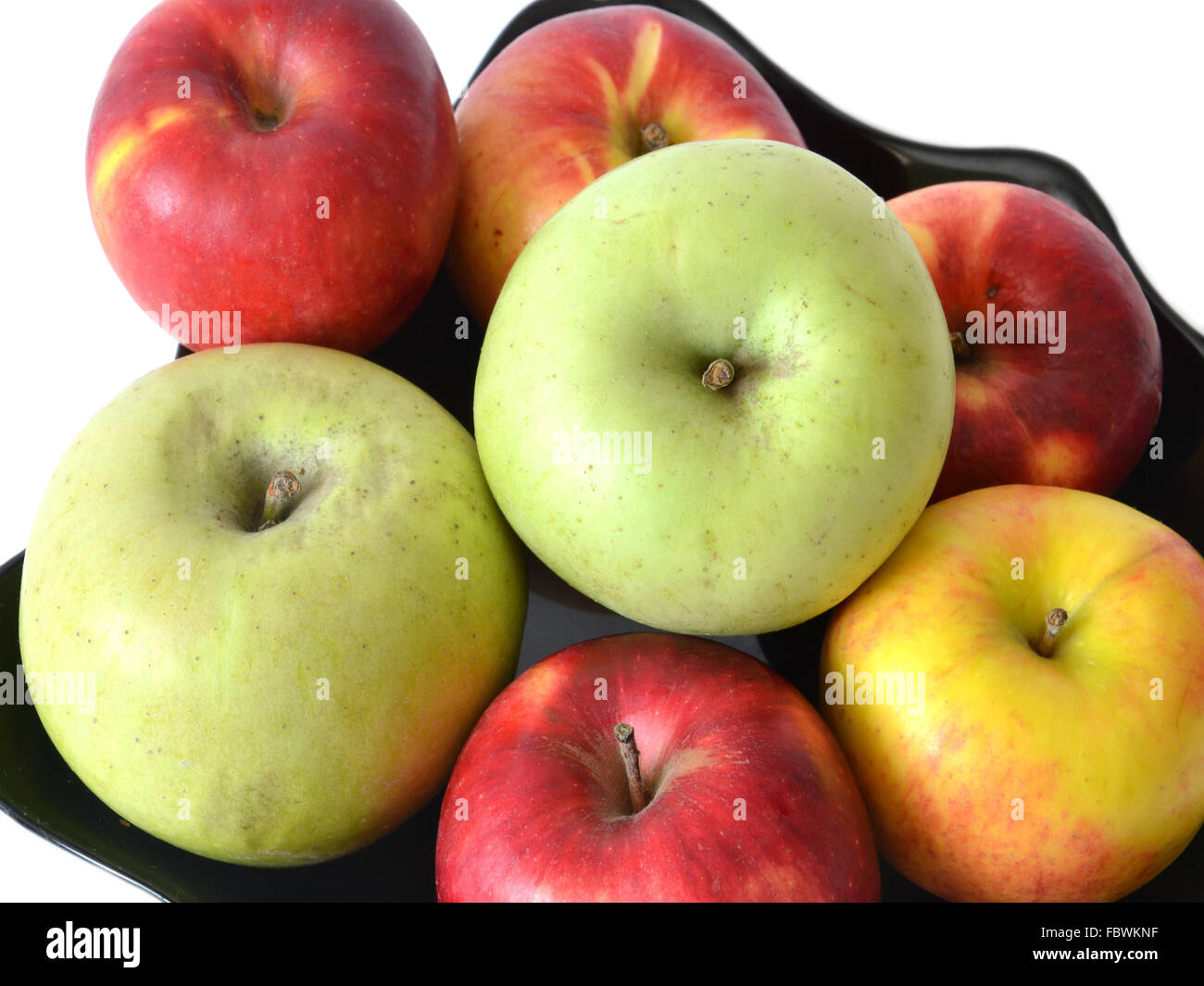 Apples pile on plate Stock Photo - Alamy