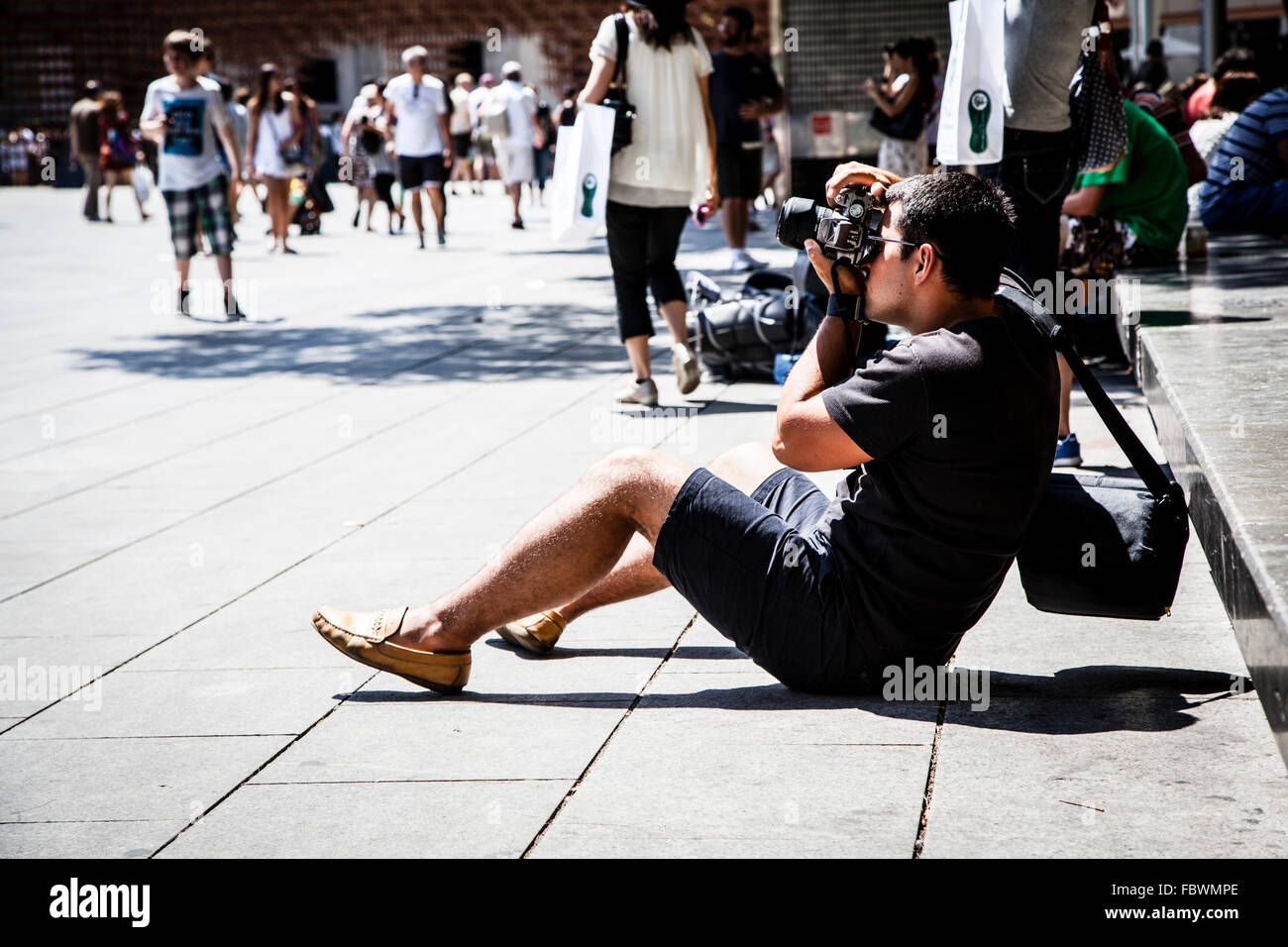 Seated camera photographer hi-res stock photography and images - Alamy