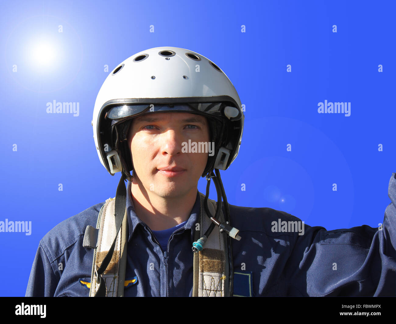 The military pilot in a helmet in dark blue overalls separately Stock ...