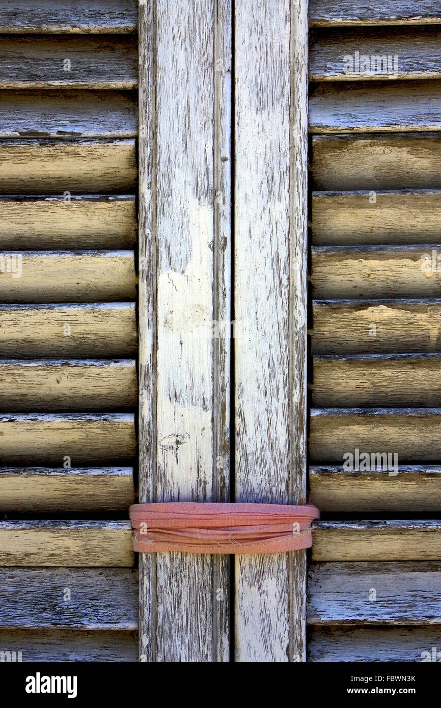 brown wood venetian blind and a pink rope Stock Photo - Alamy