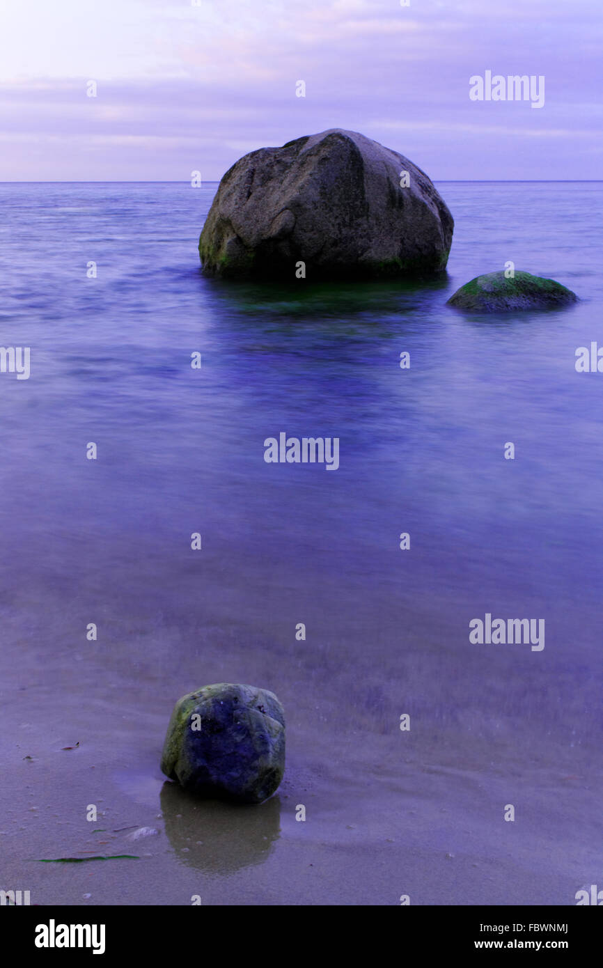 Stone in the surf Stock Photo - Alamy