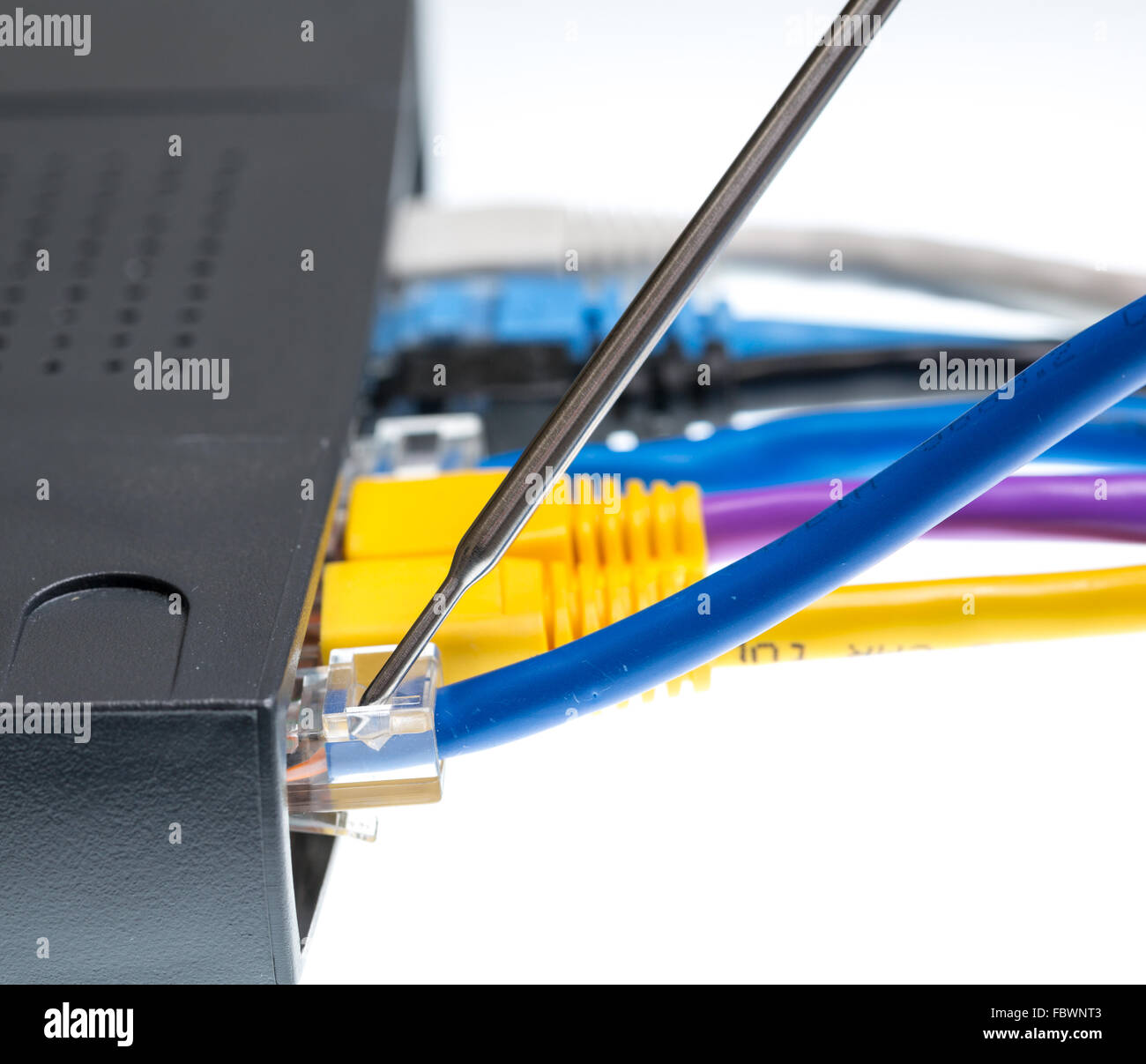 Hand plugs ethernet cable into router hi-res stock photography and ...