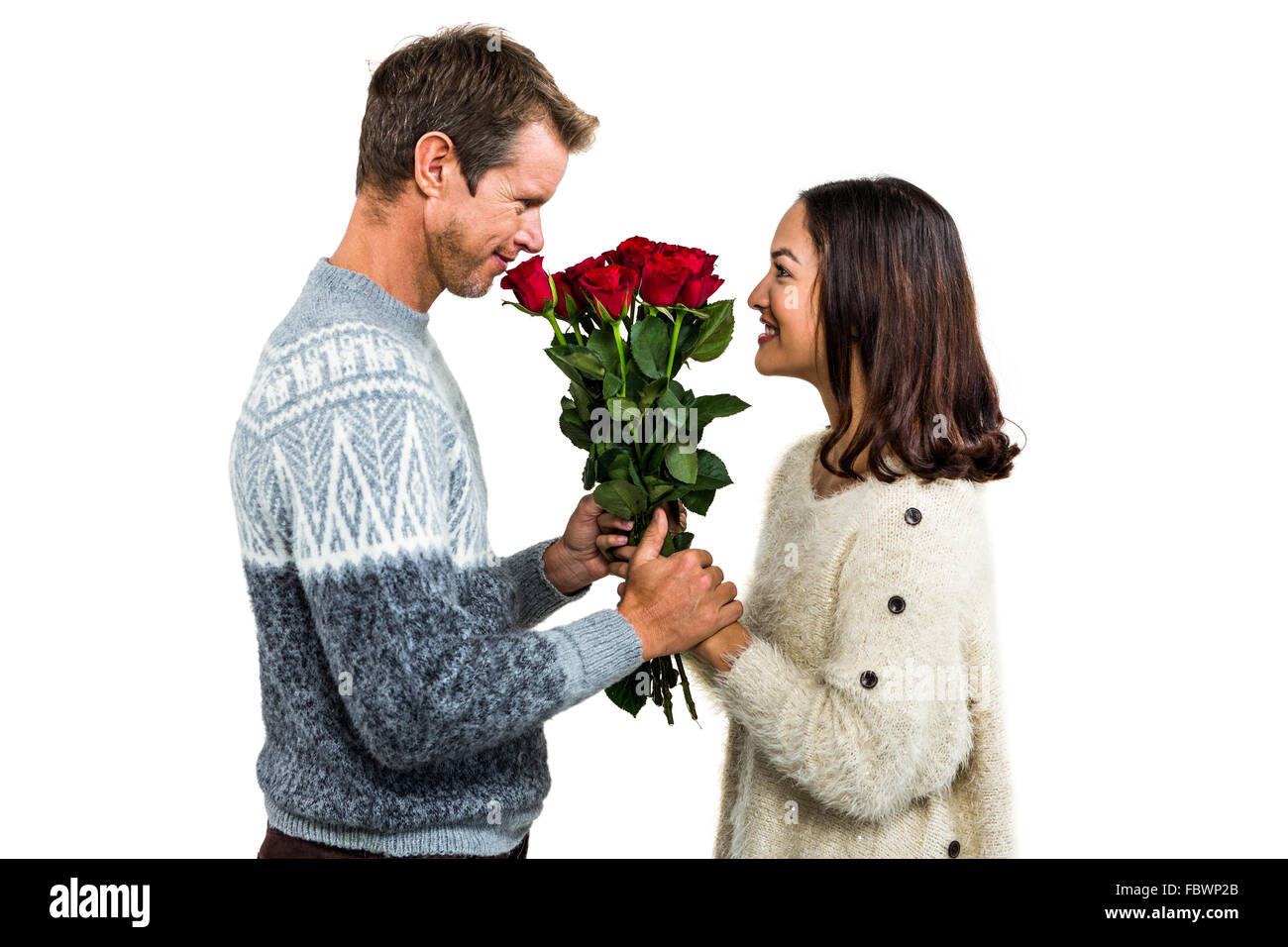 Romantic young couple holding rose hi-res stock photography and images ...