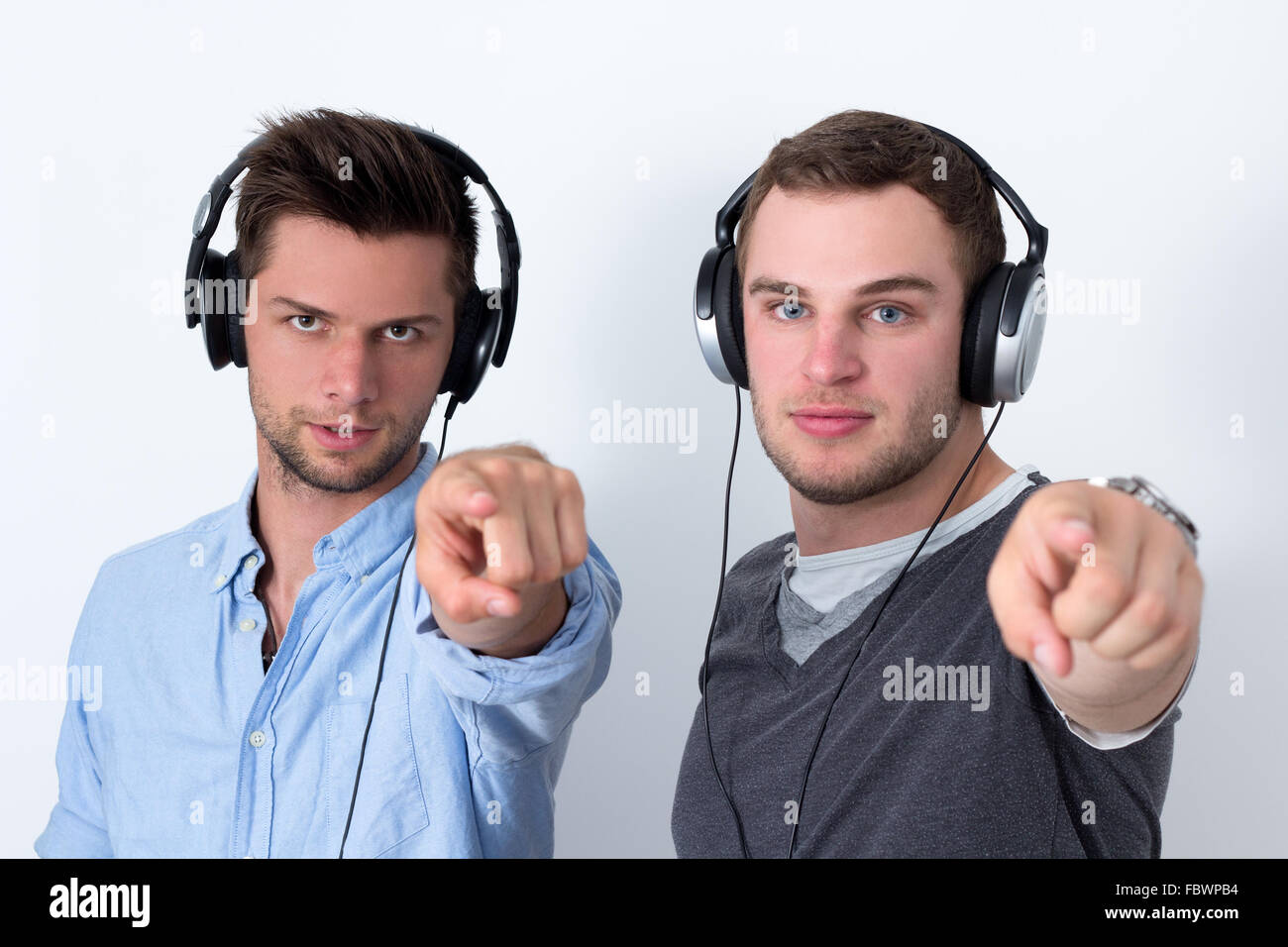 Two friends listening to music Stock Photo - Alamy