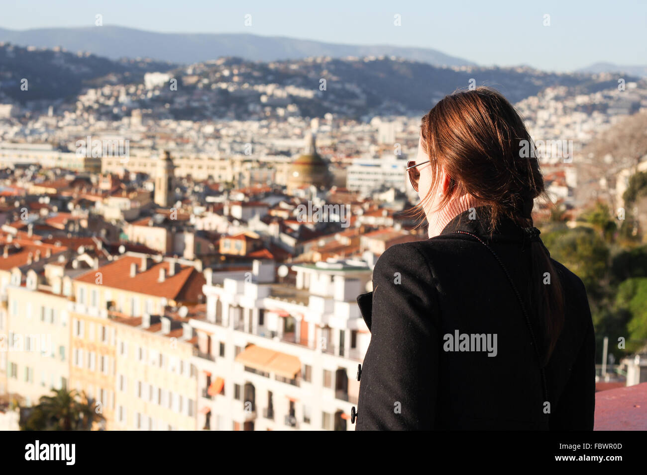 Woman looking down at the City of Nice Stock Photo - Alamy