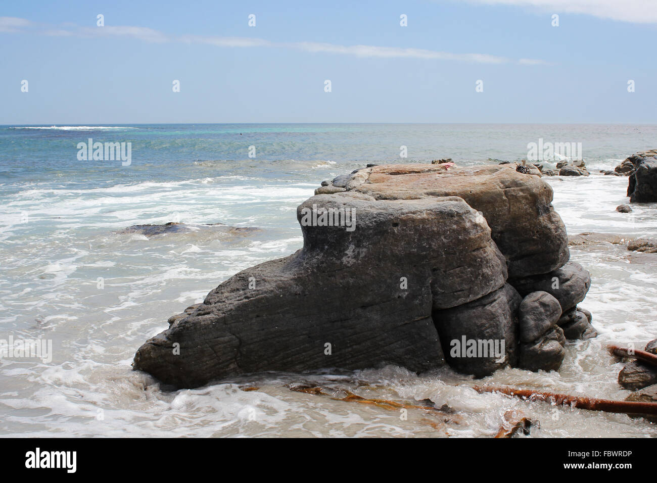 Cliff going into the Ocean Stock Photo - Alamy