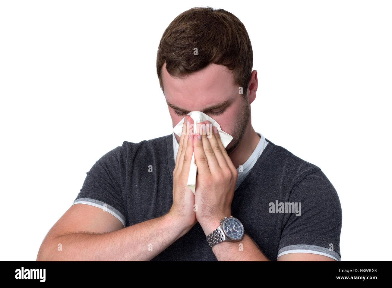 Young Man Blowing Nose Stock Photo - Alamy