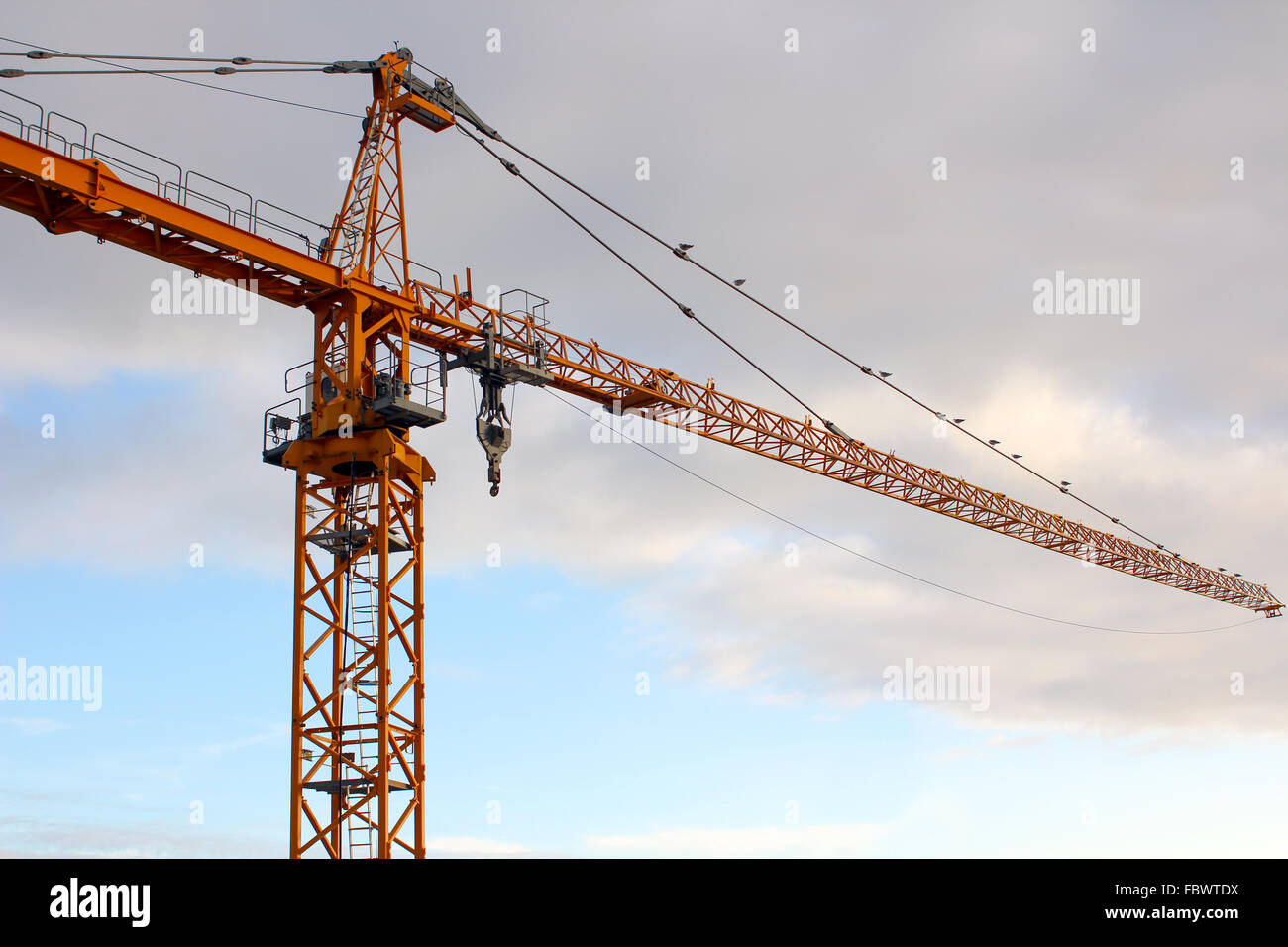 Sky clouds yellow crane hi-res stock photography and images - Alamy