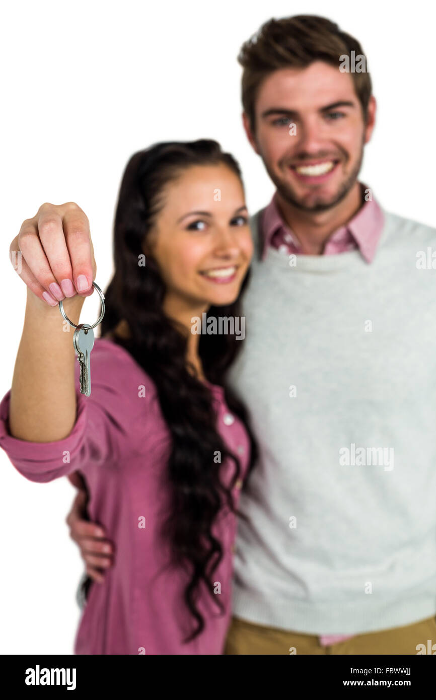 Portrait of cheerful couple holding keys Stock Photo - Alamy
