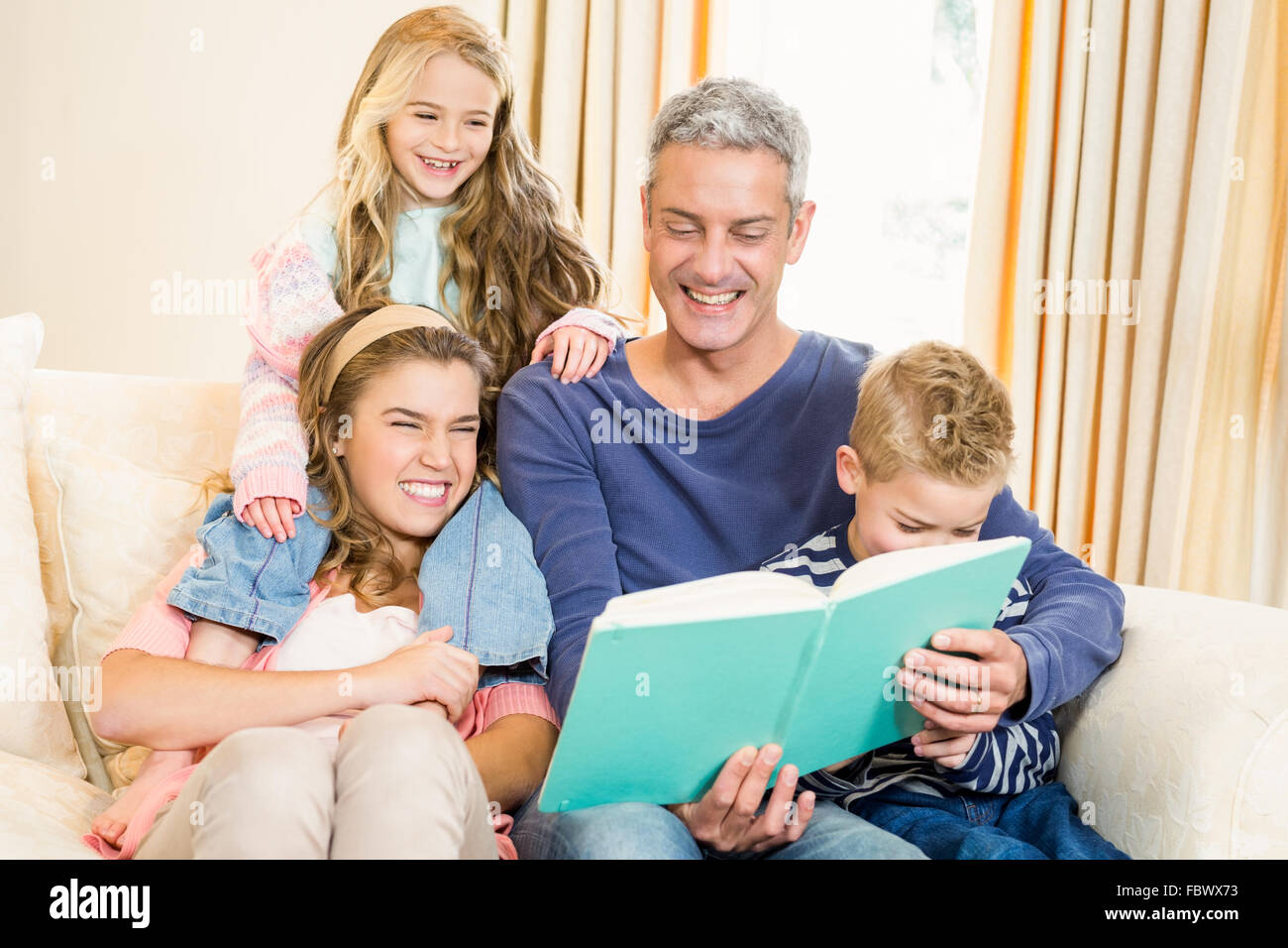 Child parents reading hi-res stock photography and images - Alamy