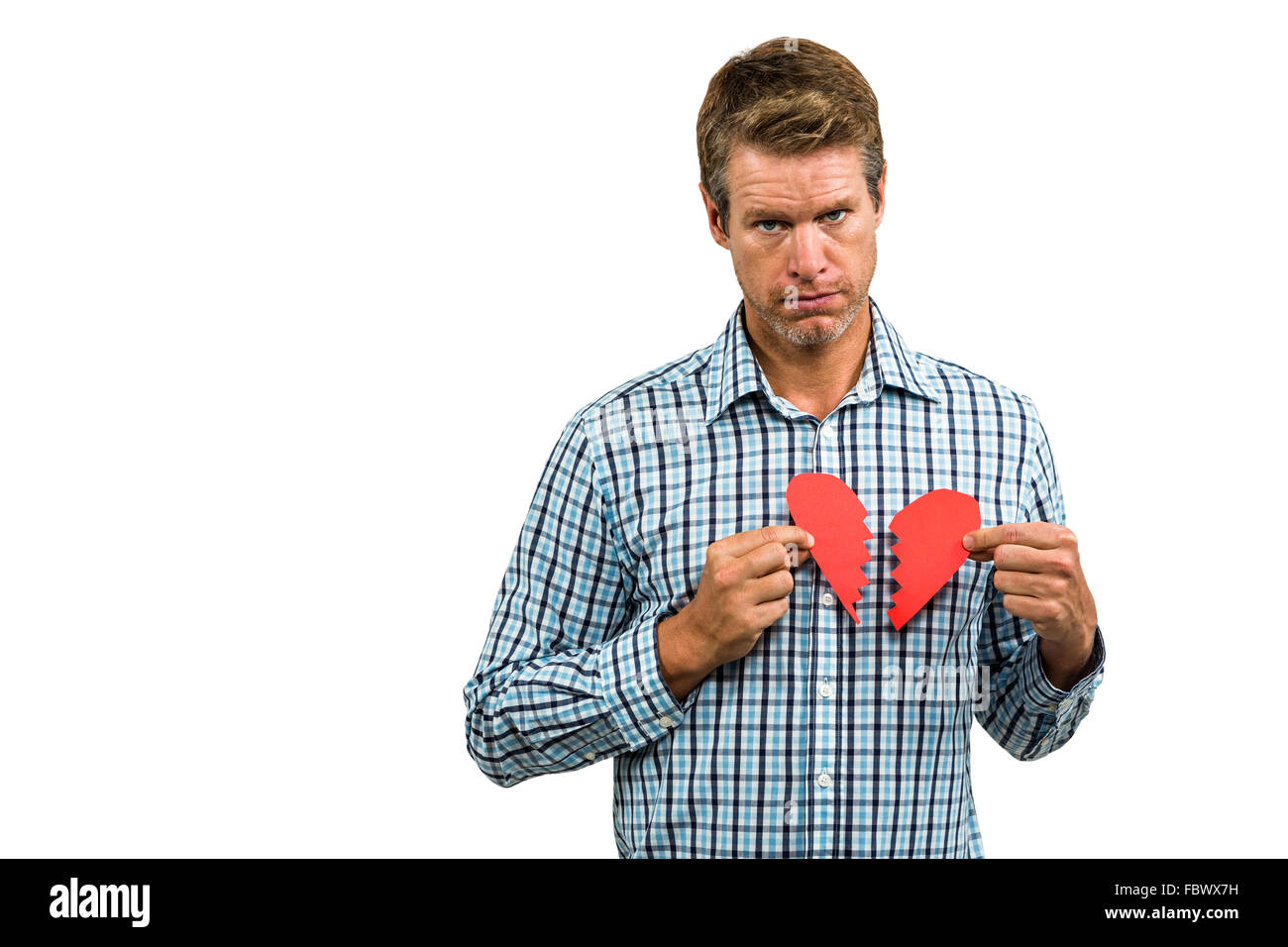 Portrait of sad man holding broken heart Stock Photo - Alamy