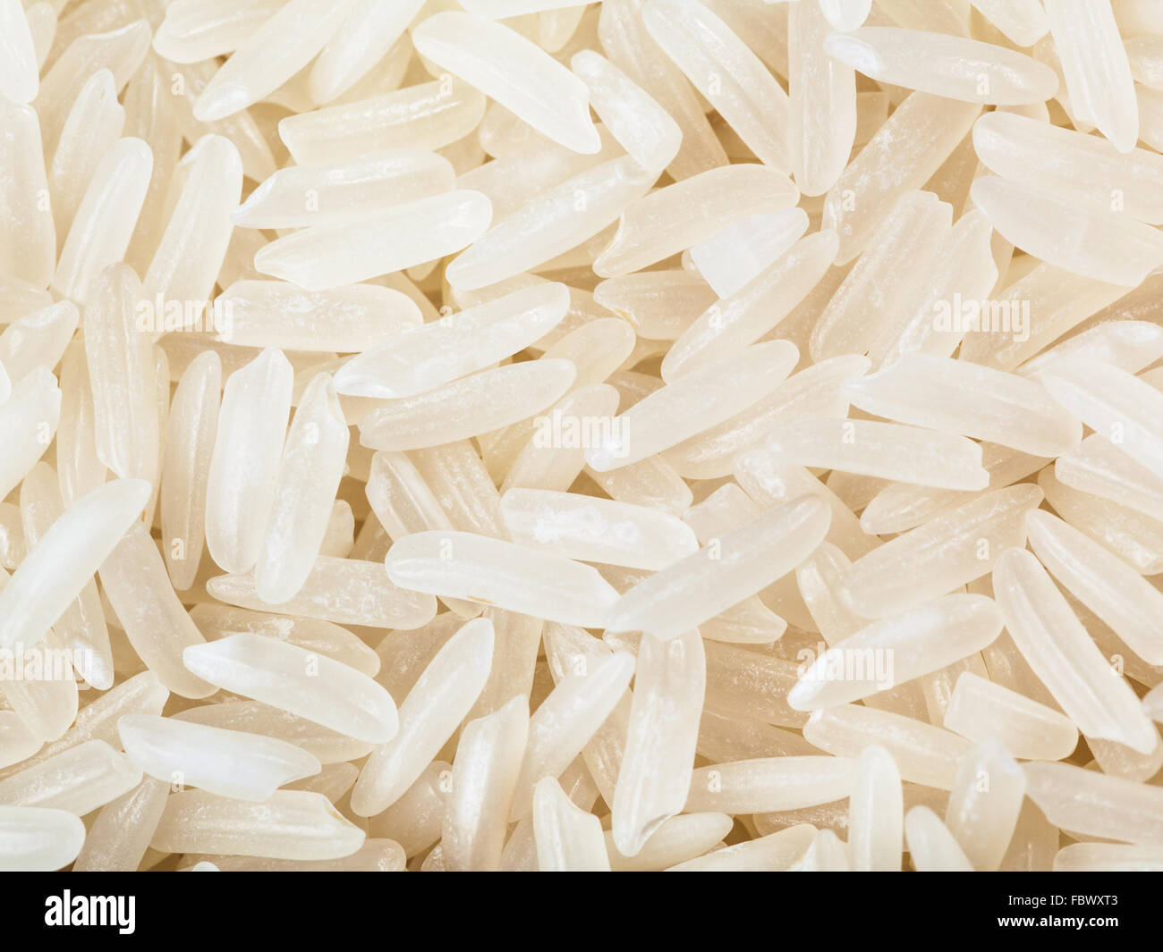 food background - long-grain uncooked white jasmine rice close up Stock ...