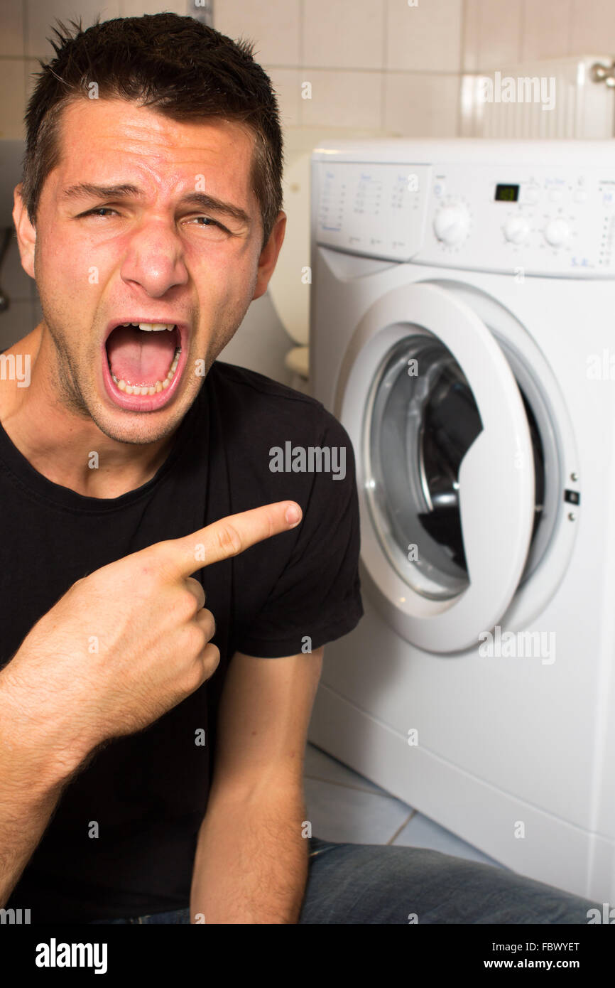 Young person washing machine hi-res stock photography and images - Alamy