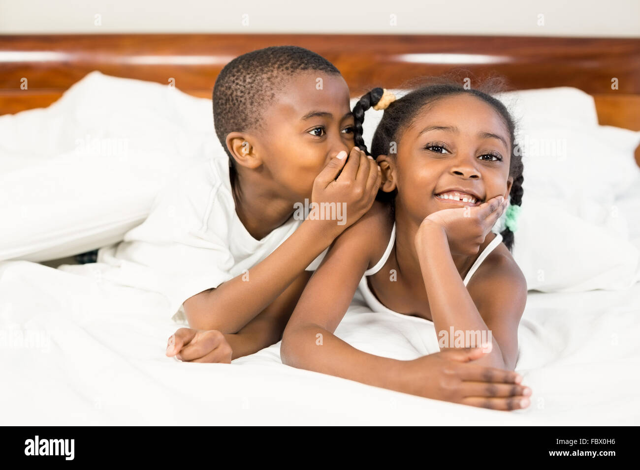 Brother and sister lying in the bed Stock Photo - Alamy