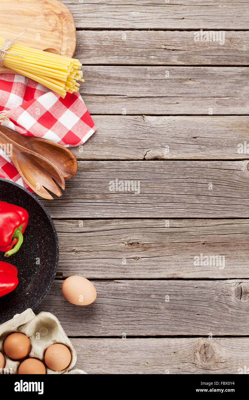 Cooking utensils and ingredients on wooden table. Top view with copy ...