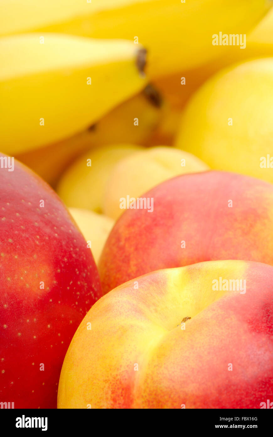 red and yellow background of fresh fruits Stock Photo - Alamy